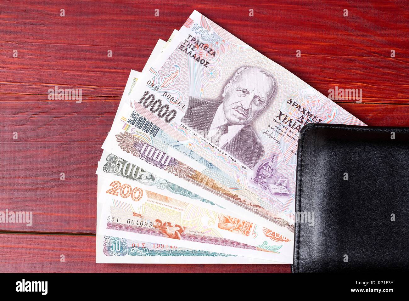 Greek money in the black wallet Stock Photo - Alamy