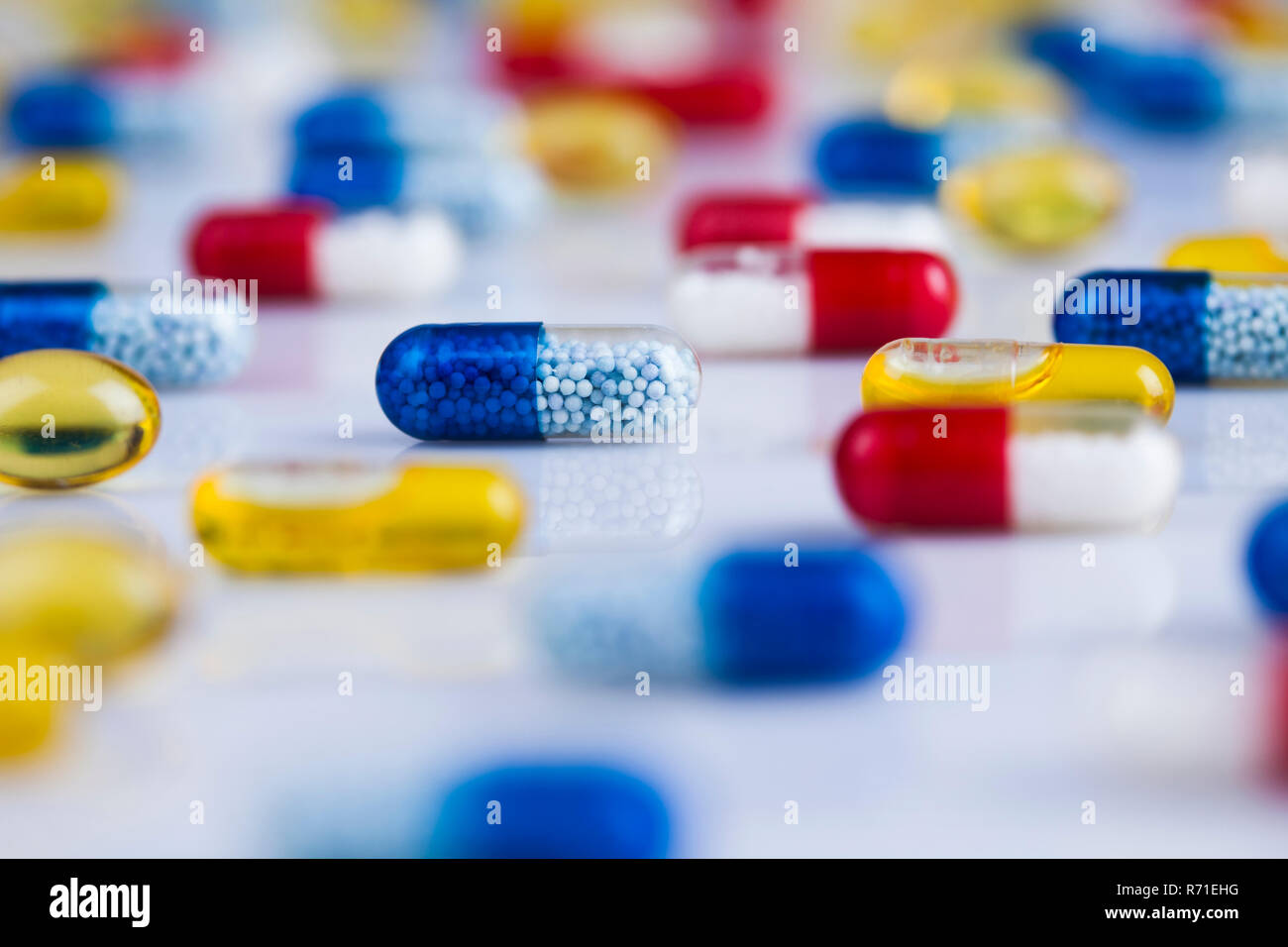 Composition with variety of drug pills background Stock Photo - Alamy