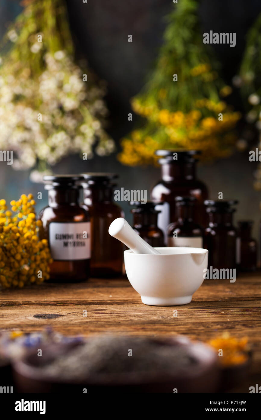 Medicine bottles and herbs background Stock Photo - Alamy