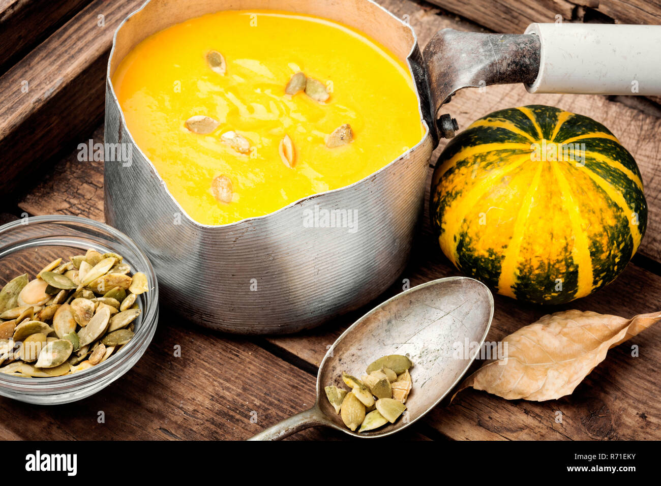 Autumn pumpkin soup in retro saucepan. Autumn food Stock Photo - Alamy