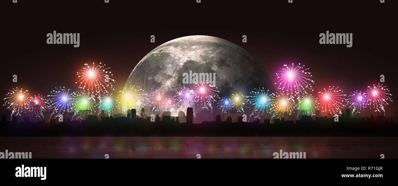 multiclor fireworks in the city with moon rising at night Stock Photo ...