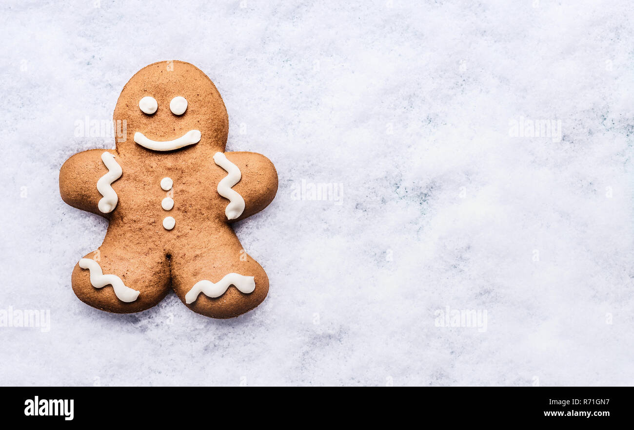 Gingerbread man on snow , top view with copy space. Christmas concept ...