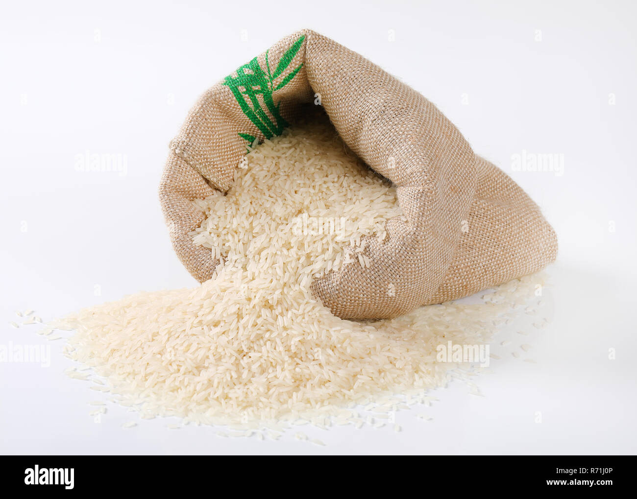bag and pile of white long grained rice Stock Photo - Alamy