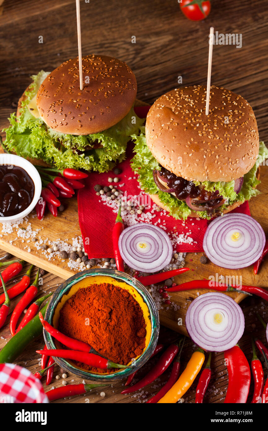 Fresh burger closeup on wooden desk background Stock Photo - Alamy