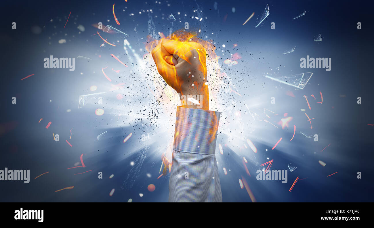 Hand hits strongly and makes fire beam around Stock Photo - Alamy