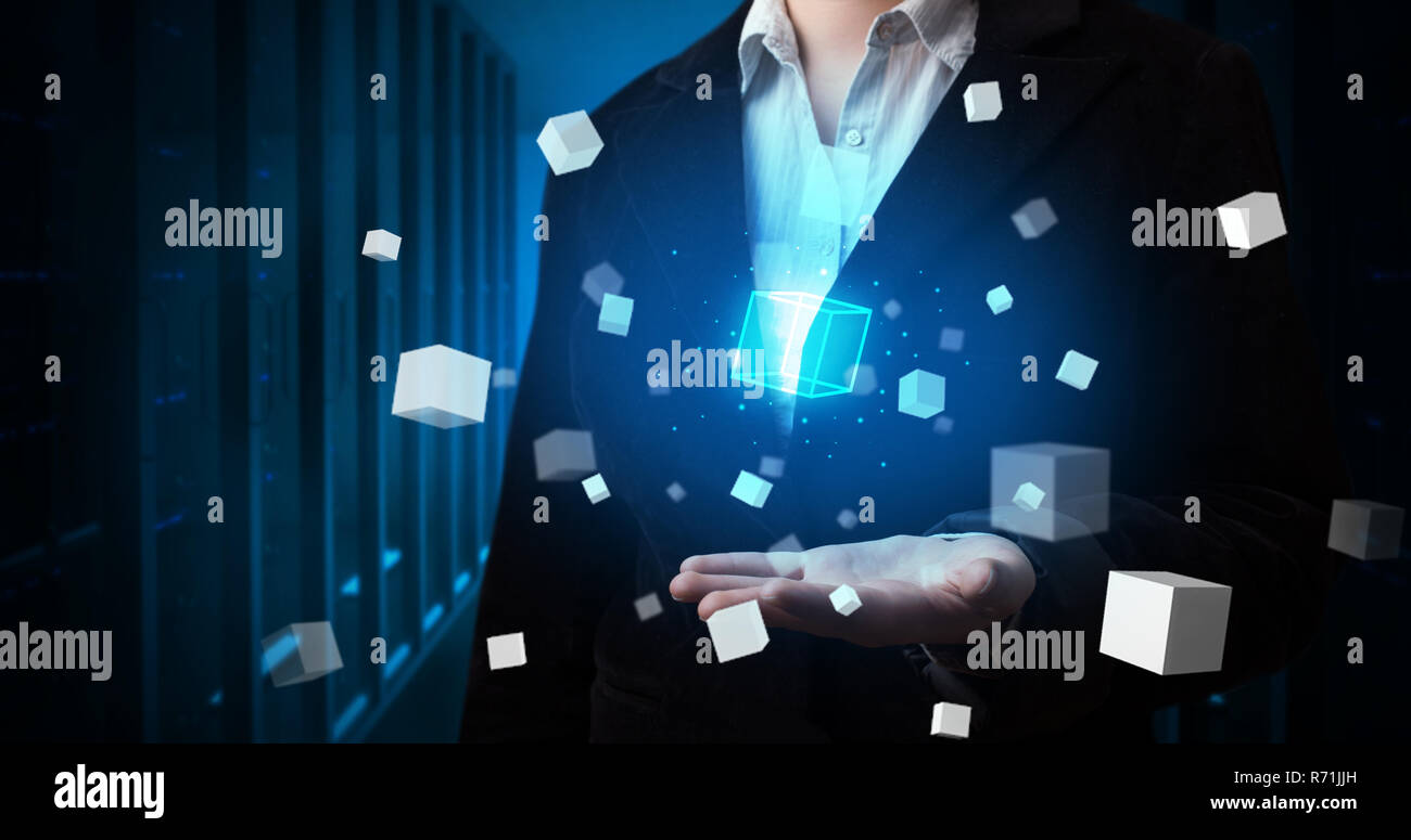 Person holding hologram projection displaying white cubes in server ...