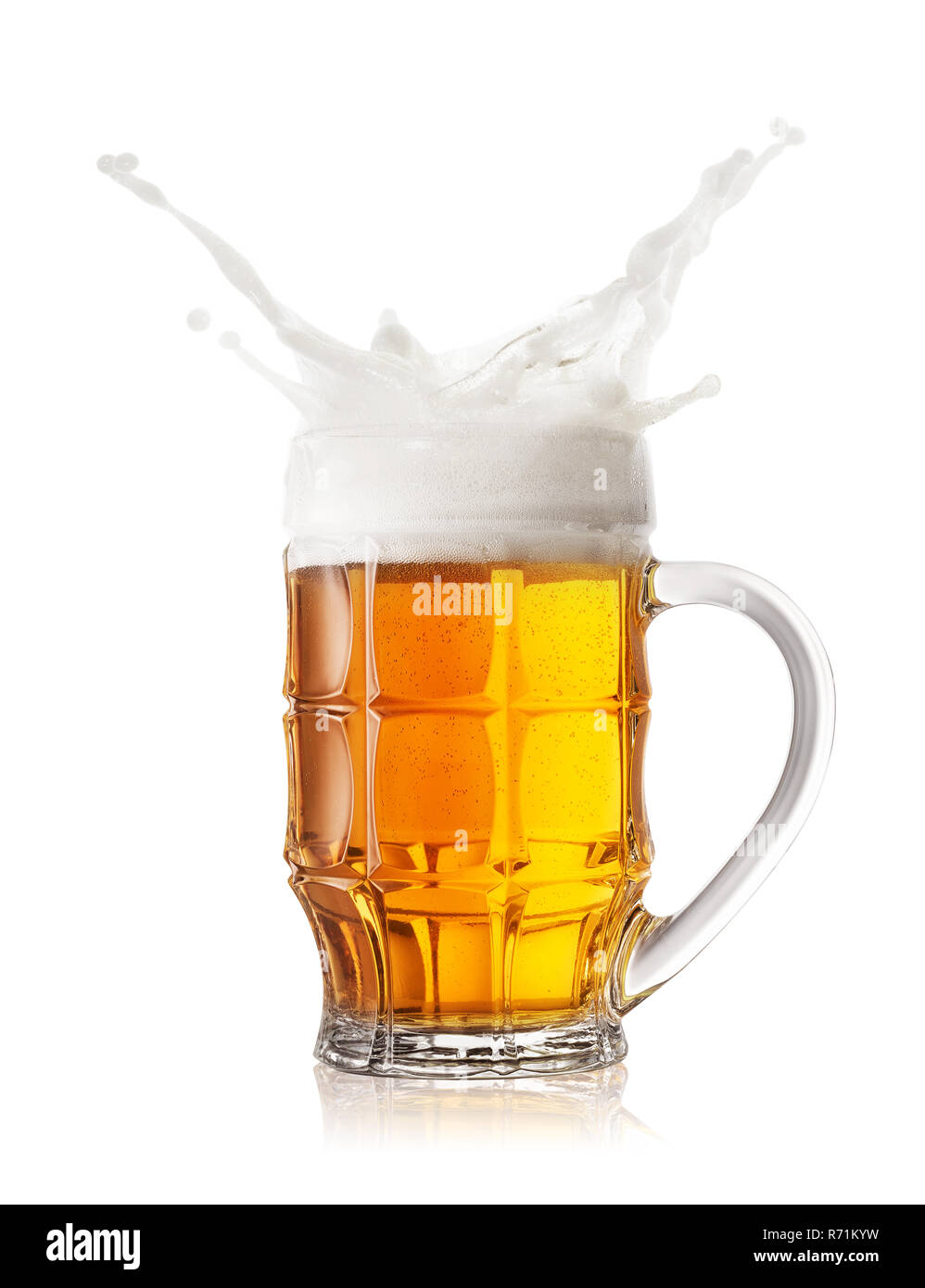 Foam splash in faceted beer mug isolated on white background Stock ...