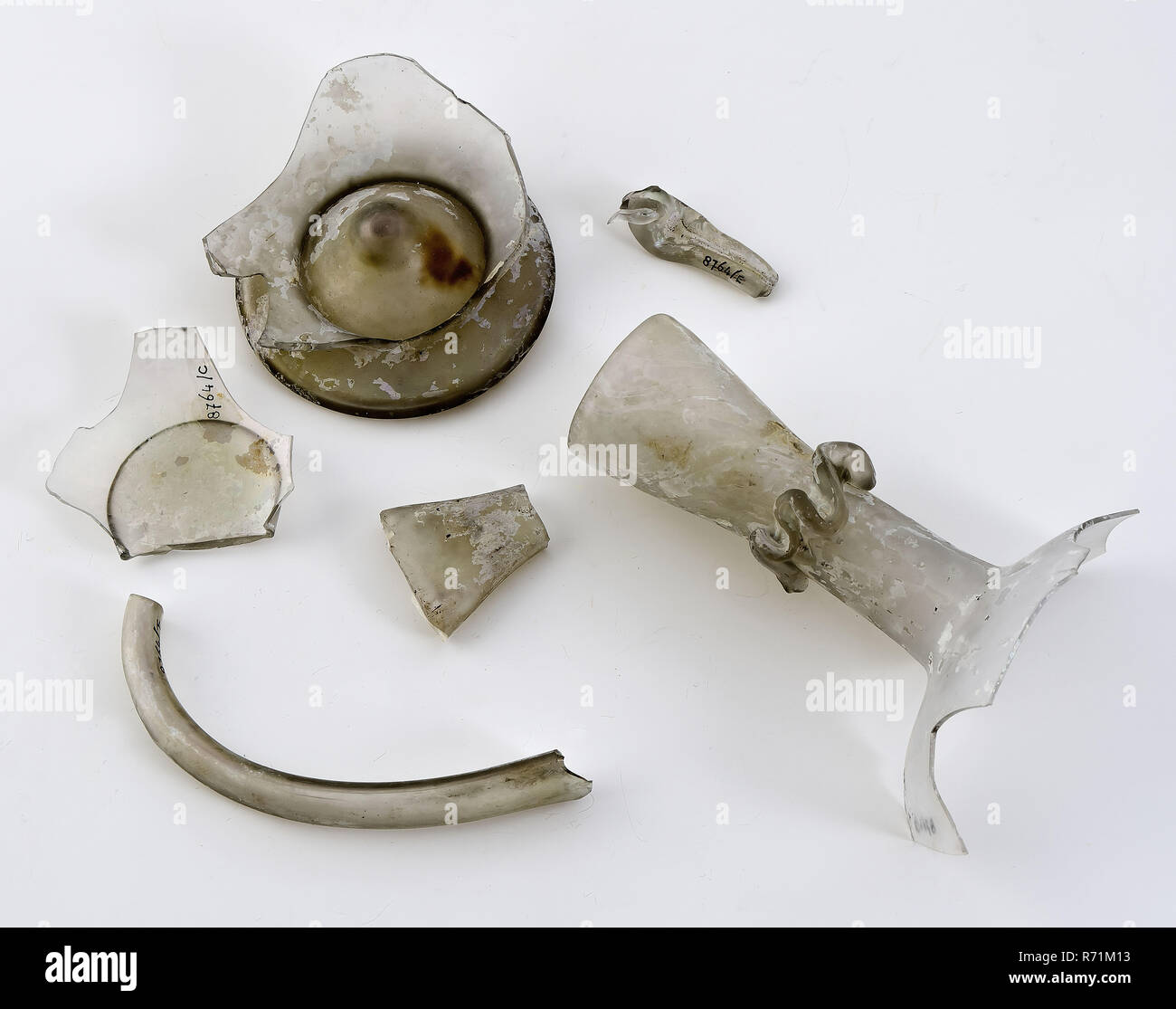 Fragments of foot, bottom, body, neck, spout and handle of spout jar ...