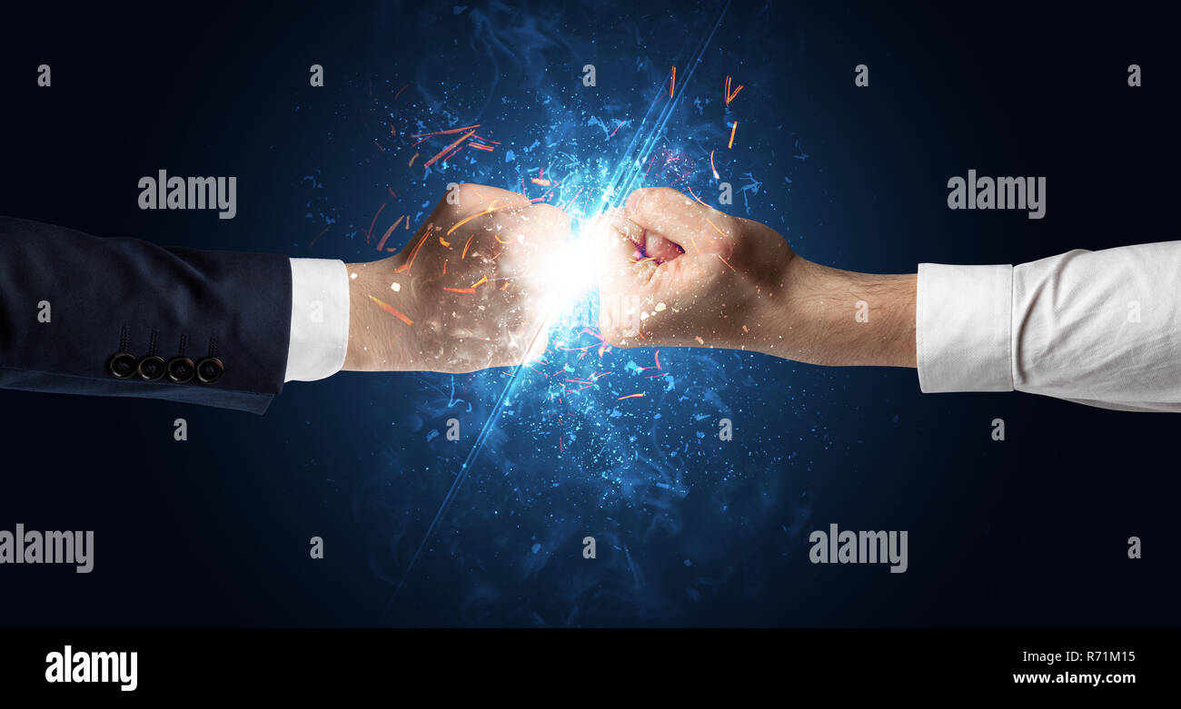 Two hands fighting with light, glow, spark and smoke concept Stock ...