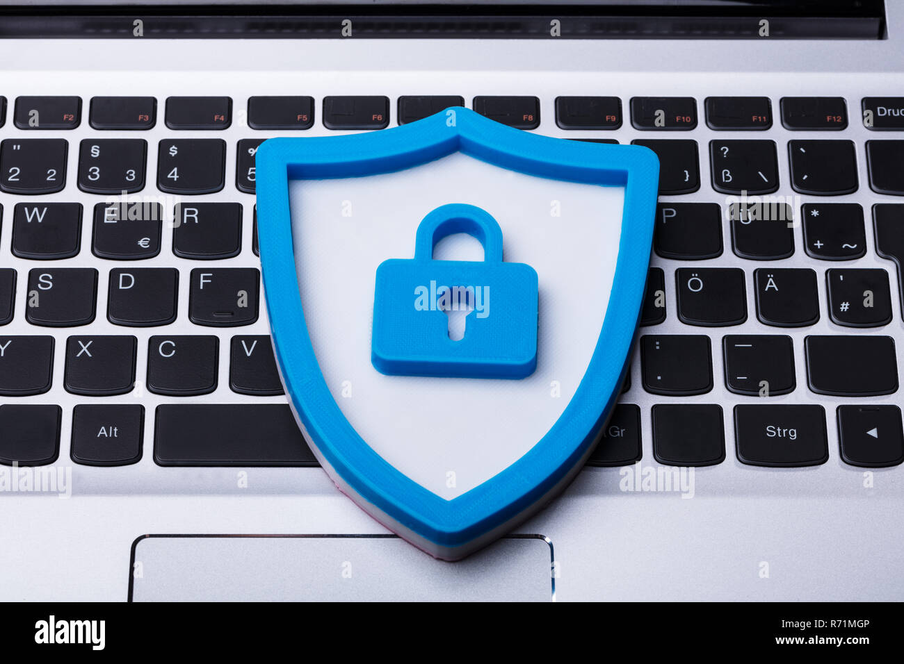 Blue Security Icon On Laptop Keypad Stock Photo - Alamy