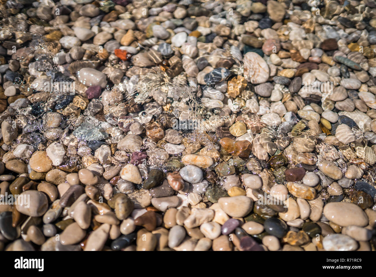 Colorful stones in the sea water Stock Photo - Alamy