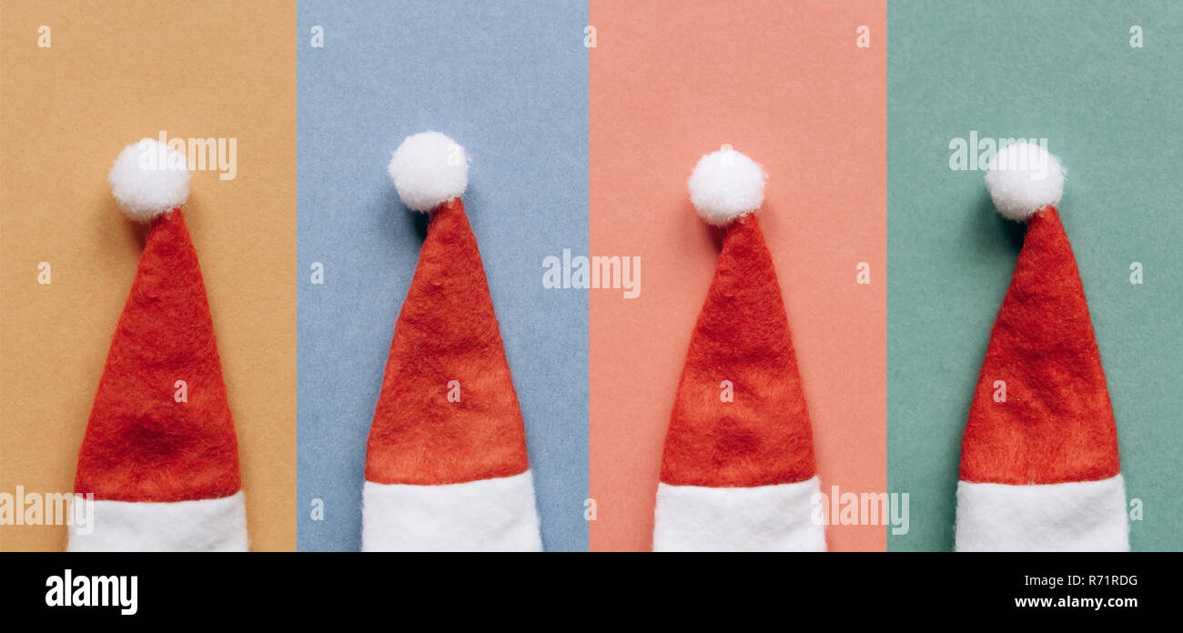 Set of Santa Claus hats on colorful backgrounds. Minimalism Stock Photo ...