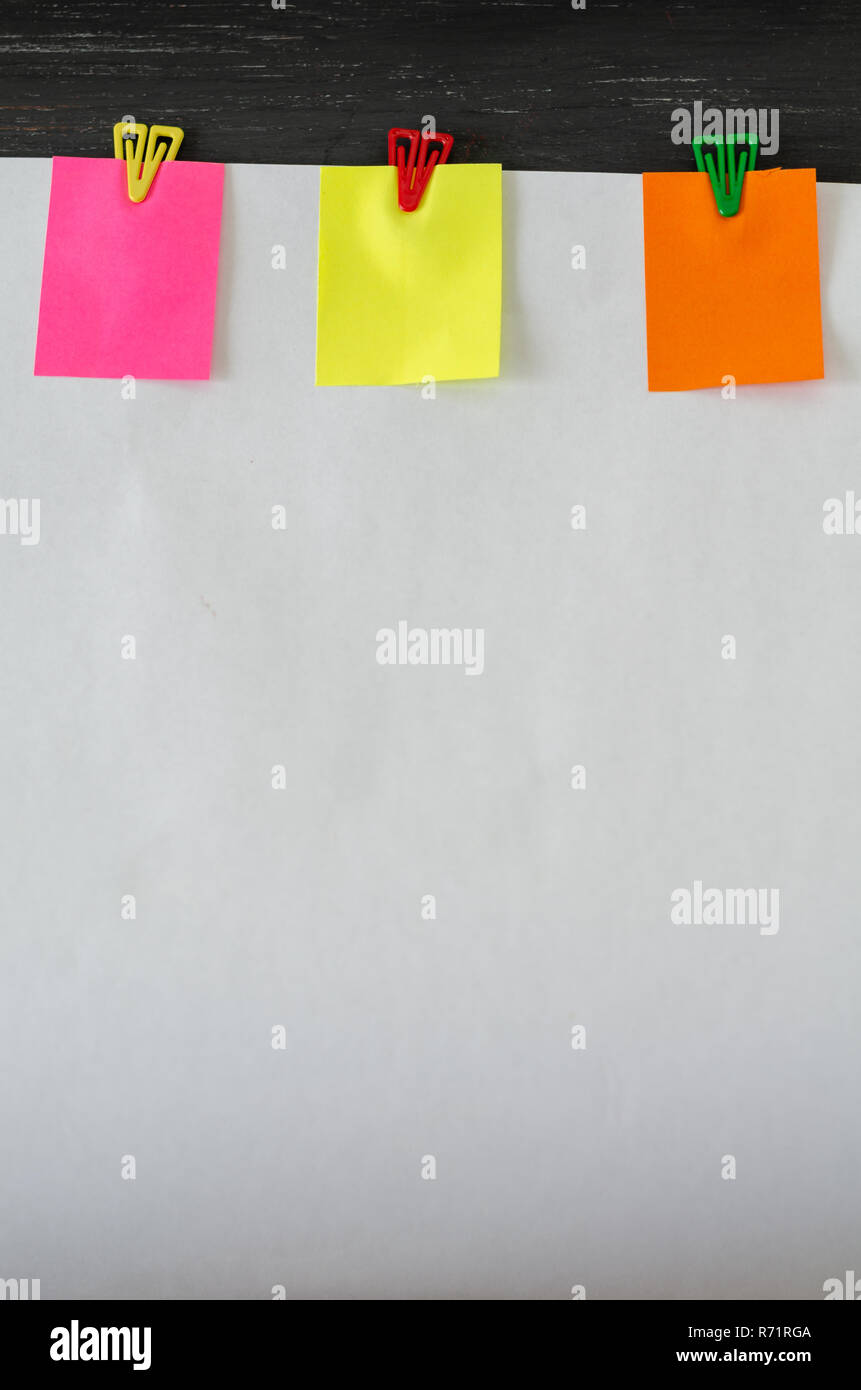 Colorful paper note on white background Stock Photo - Alamy