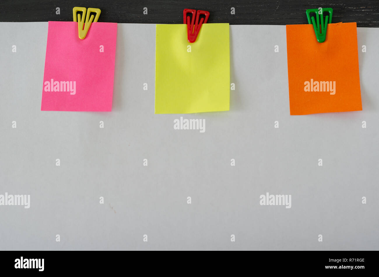 Colorful paper note on white background Stock Photo - Alamy