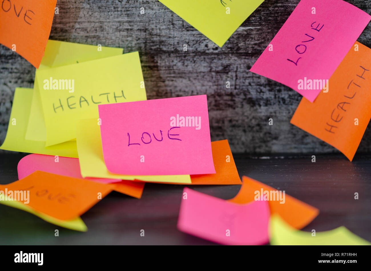 Good wishes are written on colorful note paper. Blurred background ...