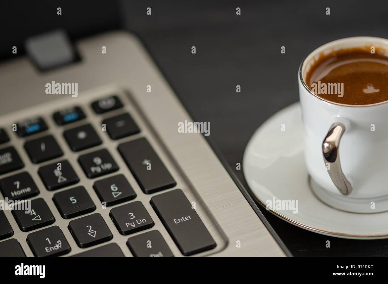 Office desk with laptop computer and coffee cup Stock Photo - Alamy