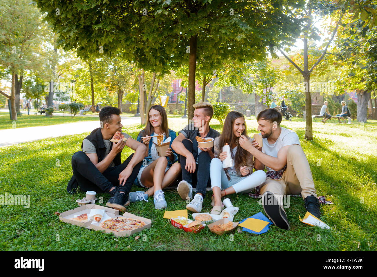 Getting relaxed with friends Stock Photo - Alamy