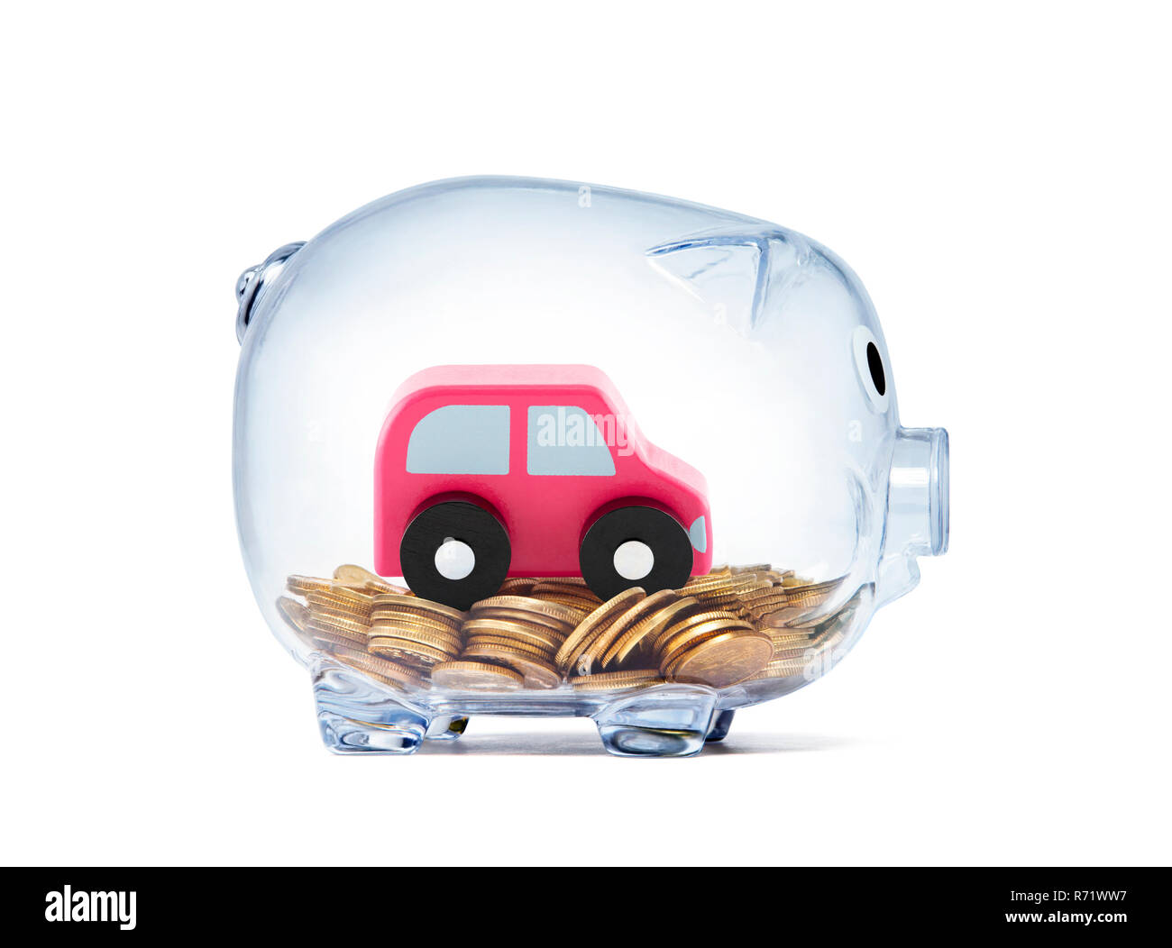 Car toy on coins inside transparent piggy bank with clipping path Stock ...