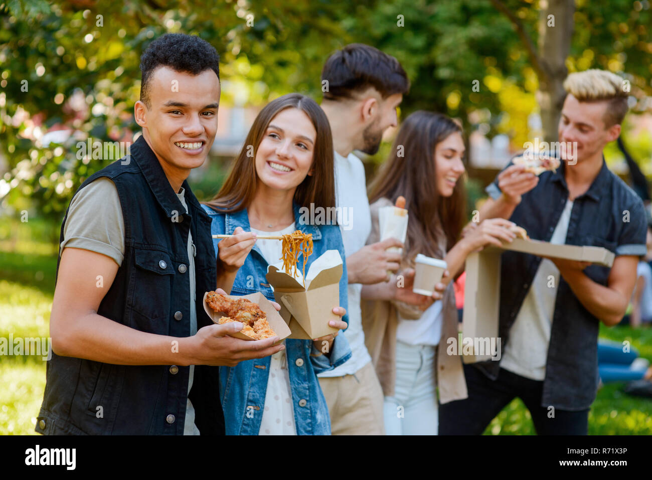 Young couple and their friends Stock Photo - Alamy