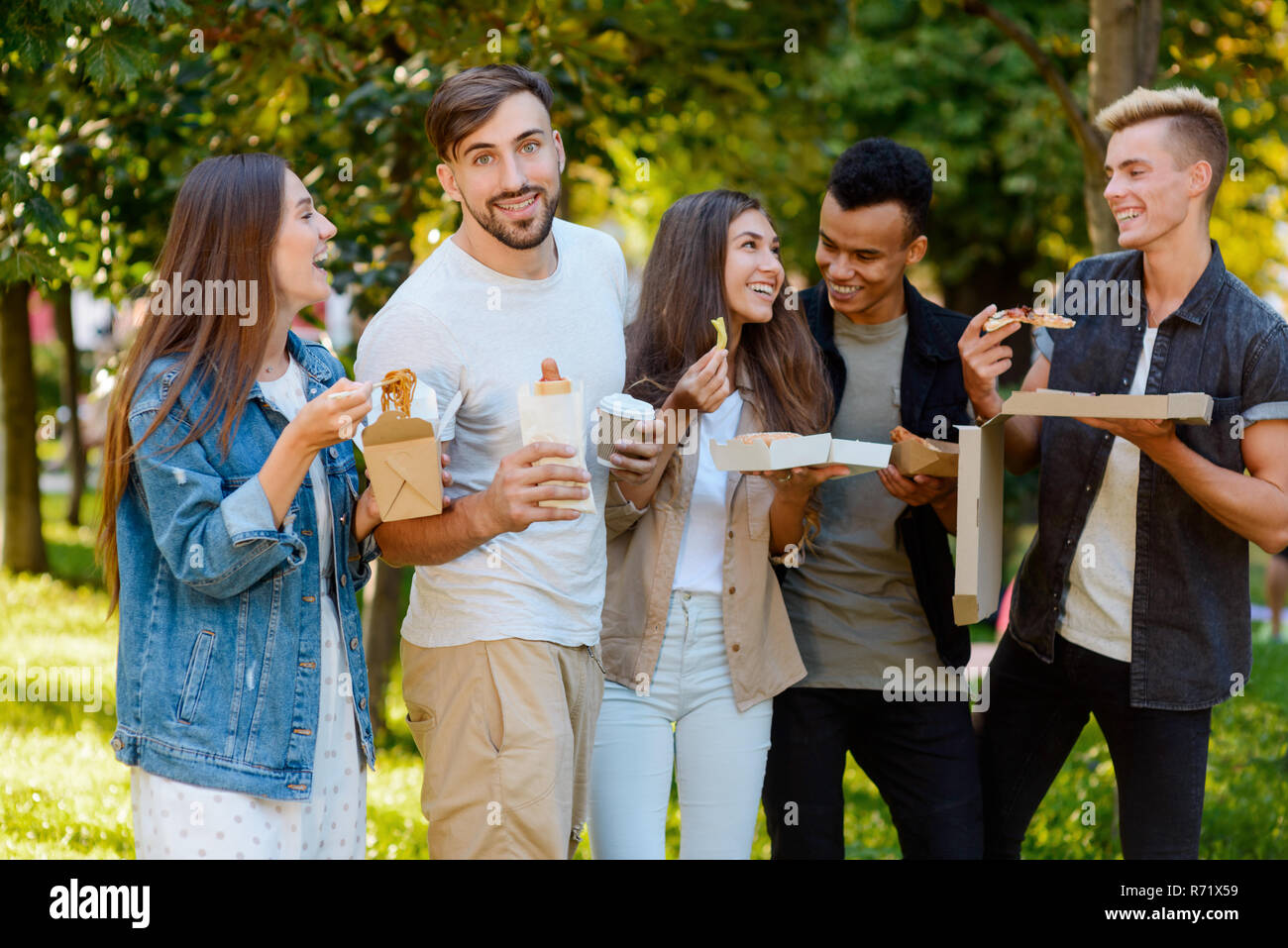Friends are eating takeout food Stock Photo - Alamy