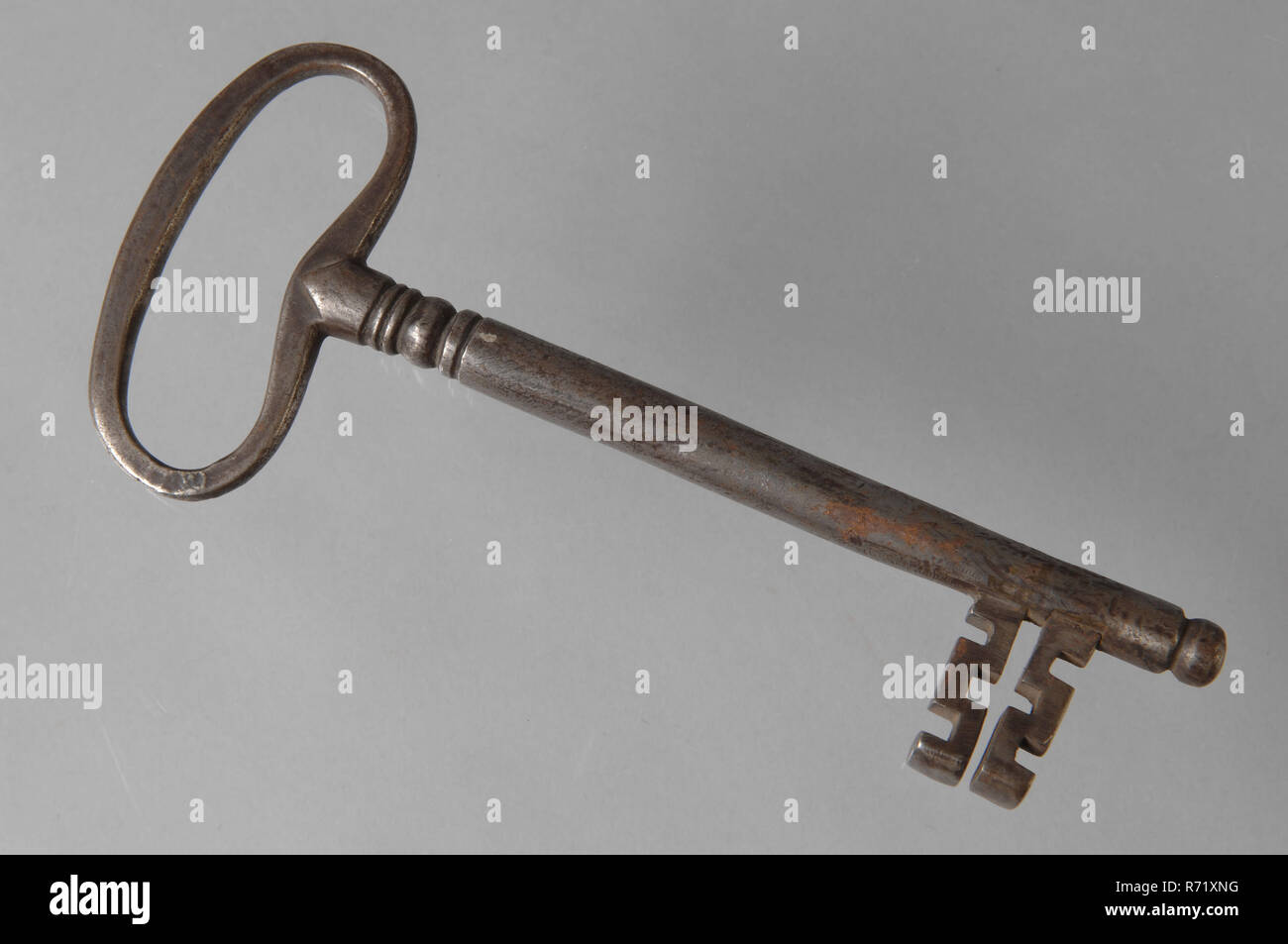 Iron key with elongated eye, solid key handle and cruciform beards in ...