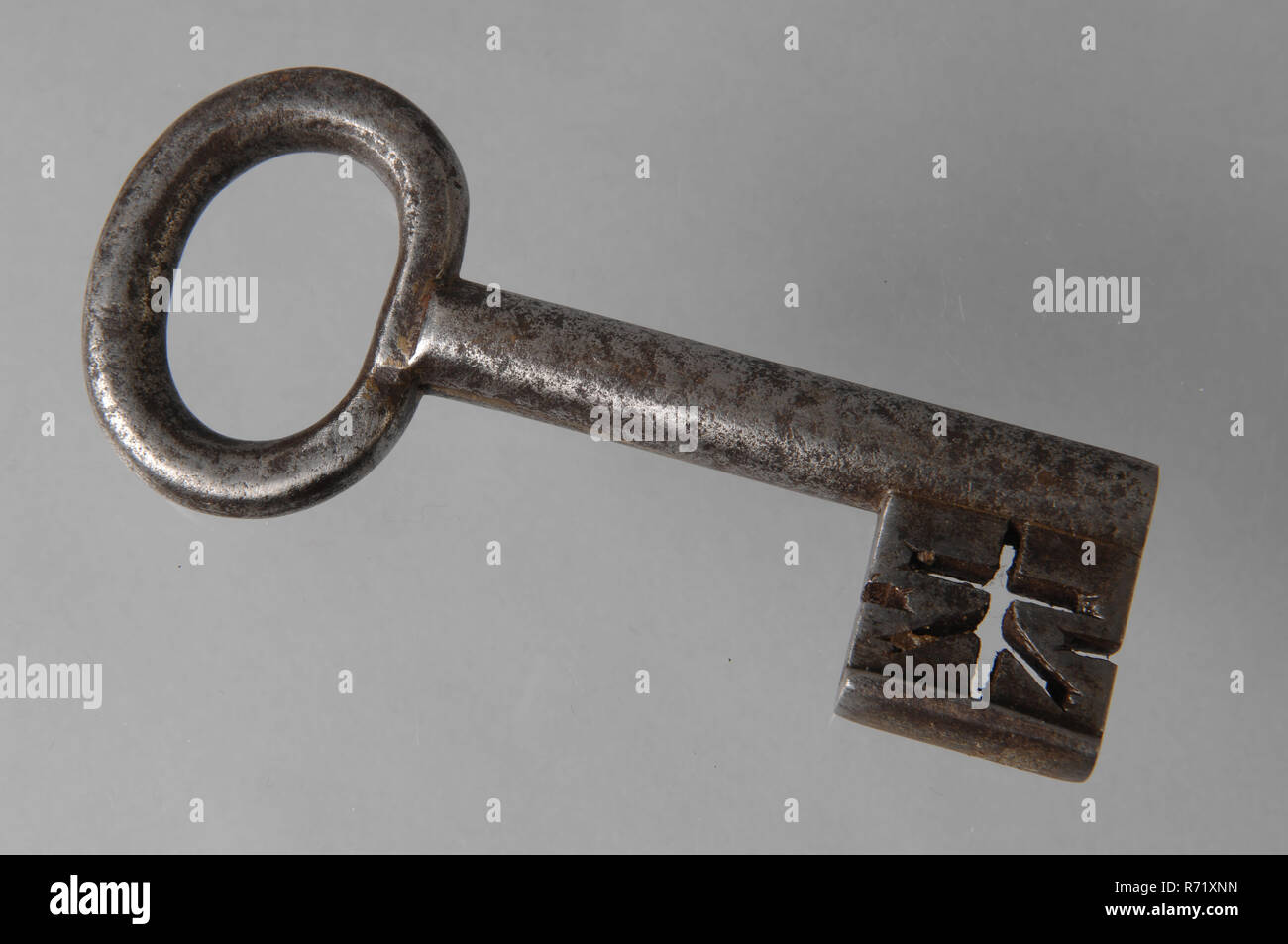 Iron key with oval eye, hollow key handle and cruciform beards in beard ...