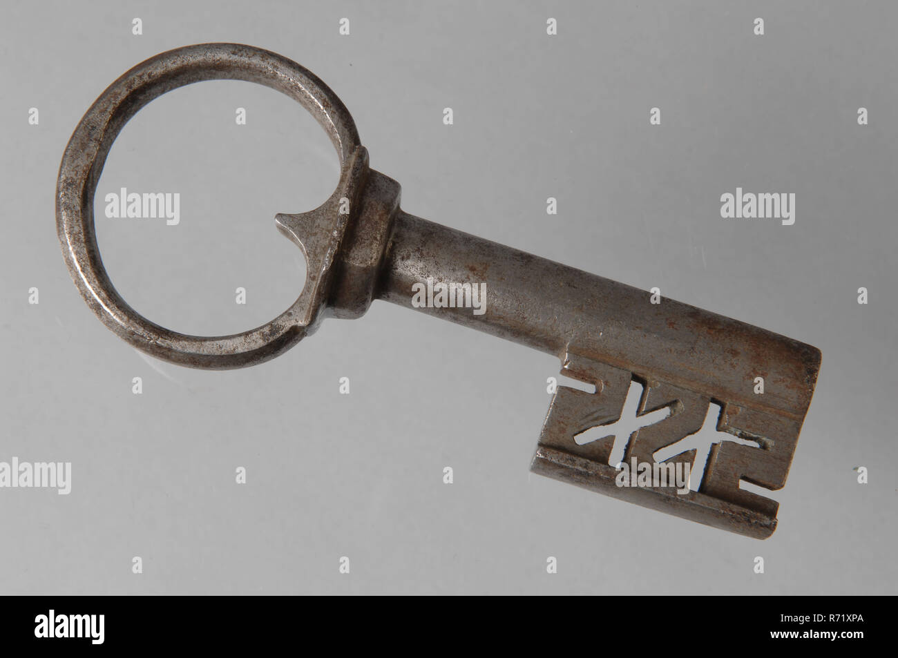 Iron key with heart-shaped eye, hollow key handle, collar and cruciform ...