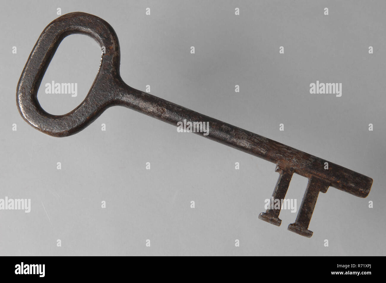 Iron key with oval eye, massive key handle and straight-shaped shaped ...
