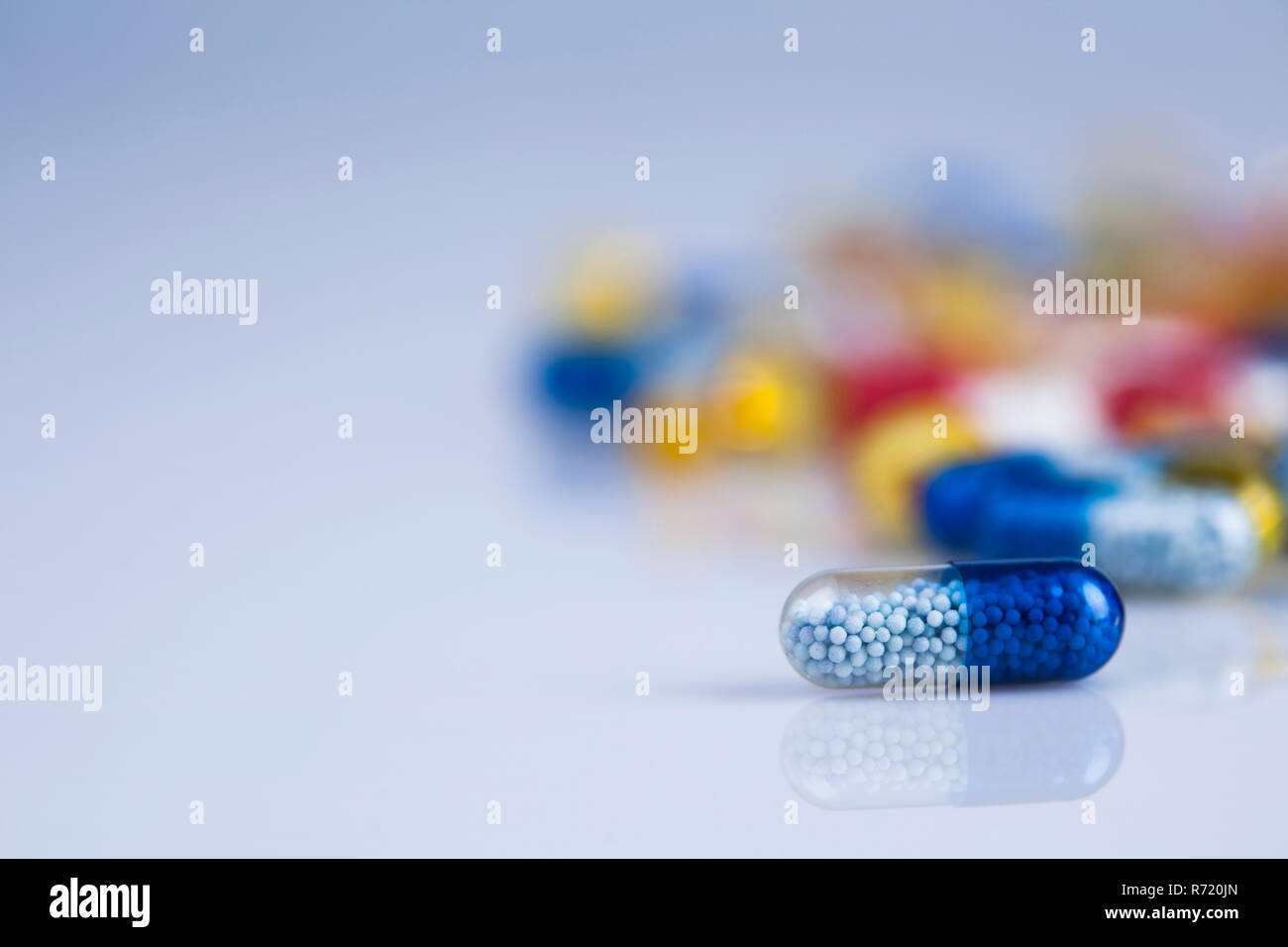Composition with variety of drug pills background Stock Photo - Alamy