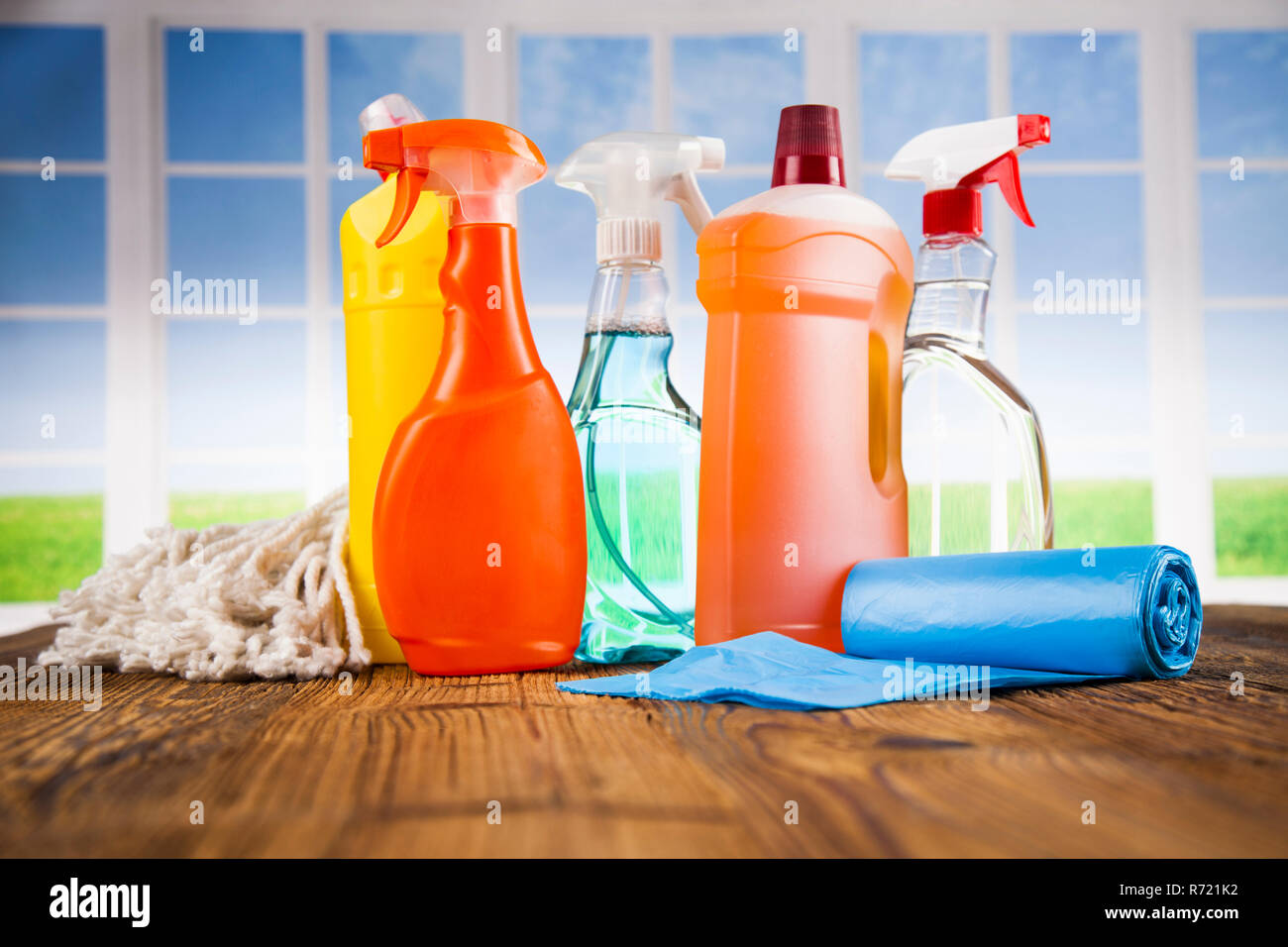 House cleaning product on wood table and window background Stock Photo ...