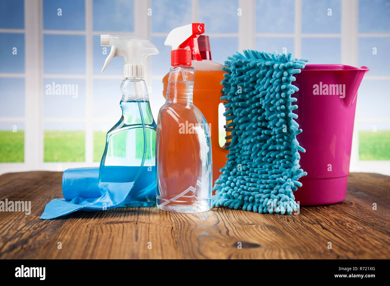 House cleaning product on wood table and window background Stock Photo ...