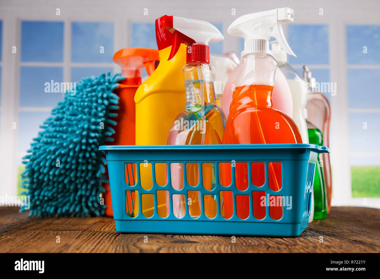 House cleaning product on wood table and window background Stock Photo ...