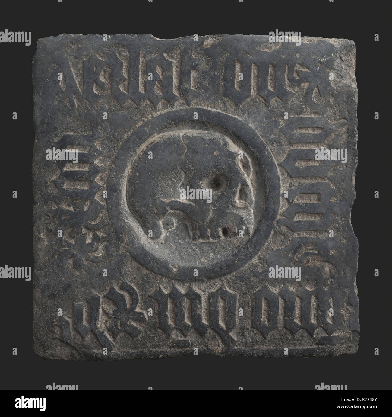 Square headstone with gothic text and skull, tombstone shale stone ...