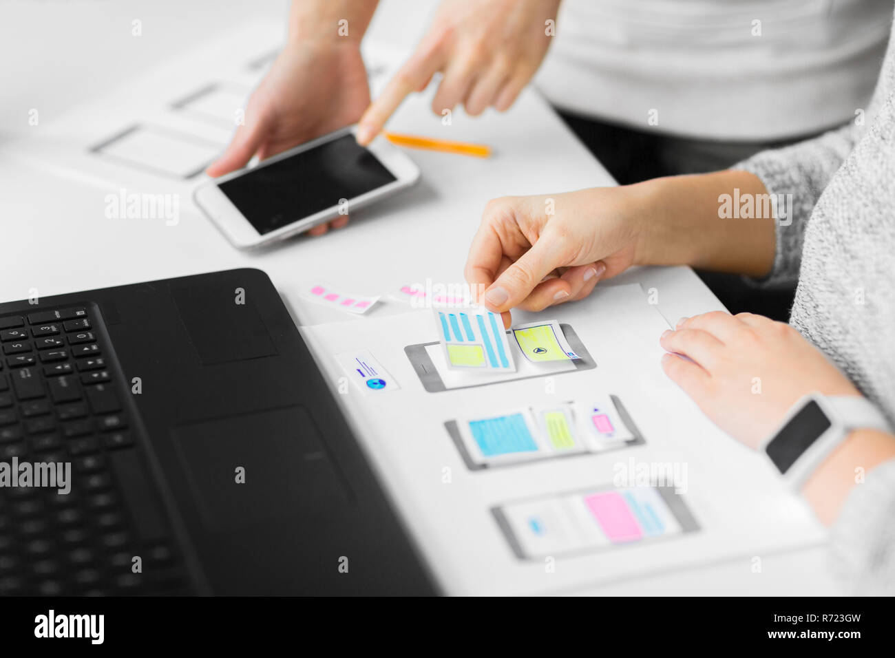 web designers creating mobile user interface Stock Photo - Alamy
