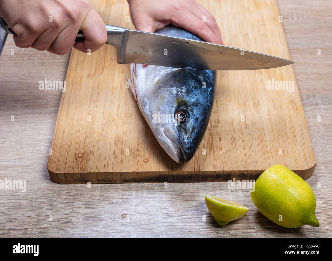 Kitchen knife cuts fish raw hi-res stock photography and images - Alamy