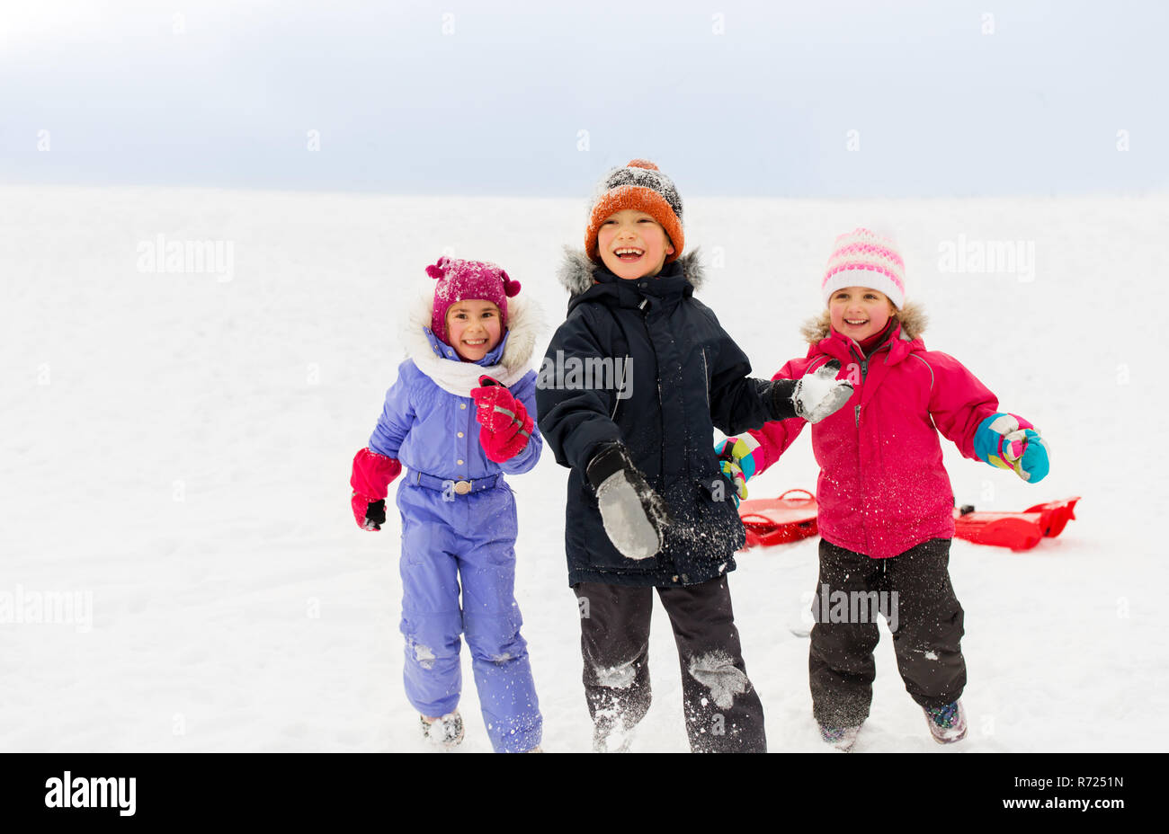 happy little kids playing outdoors in winter Stock Photo - Alamy