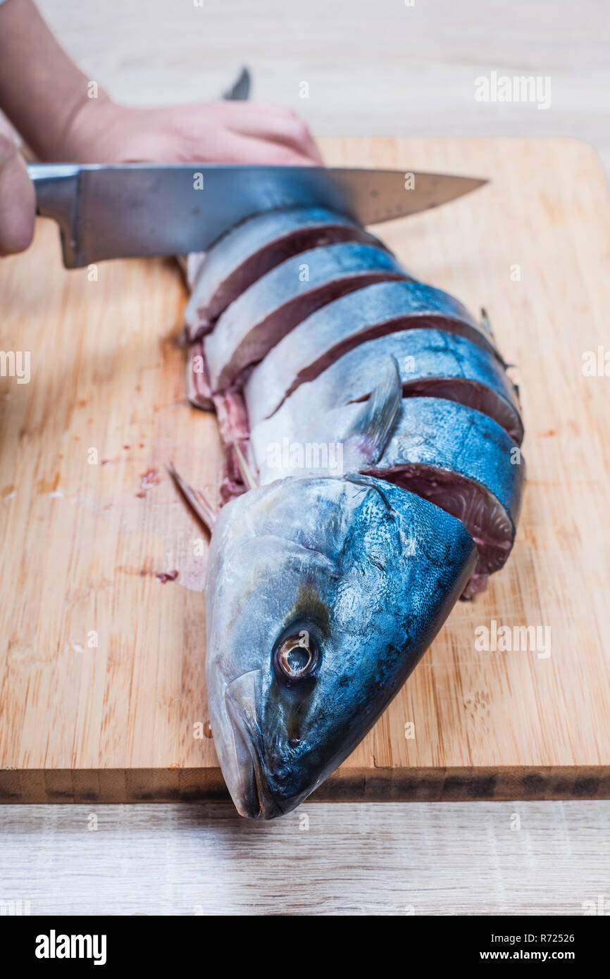 Woman cuts up fish hi-res stock photography and images - Alamy