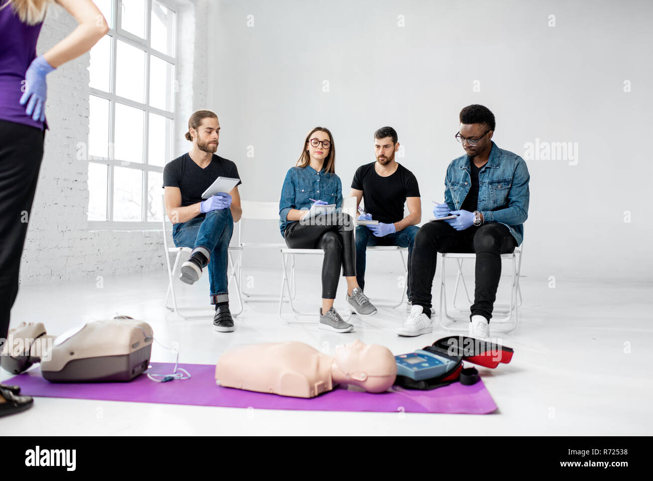 Group of young people sitting during the first aid training in the ...