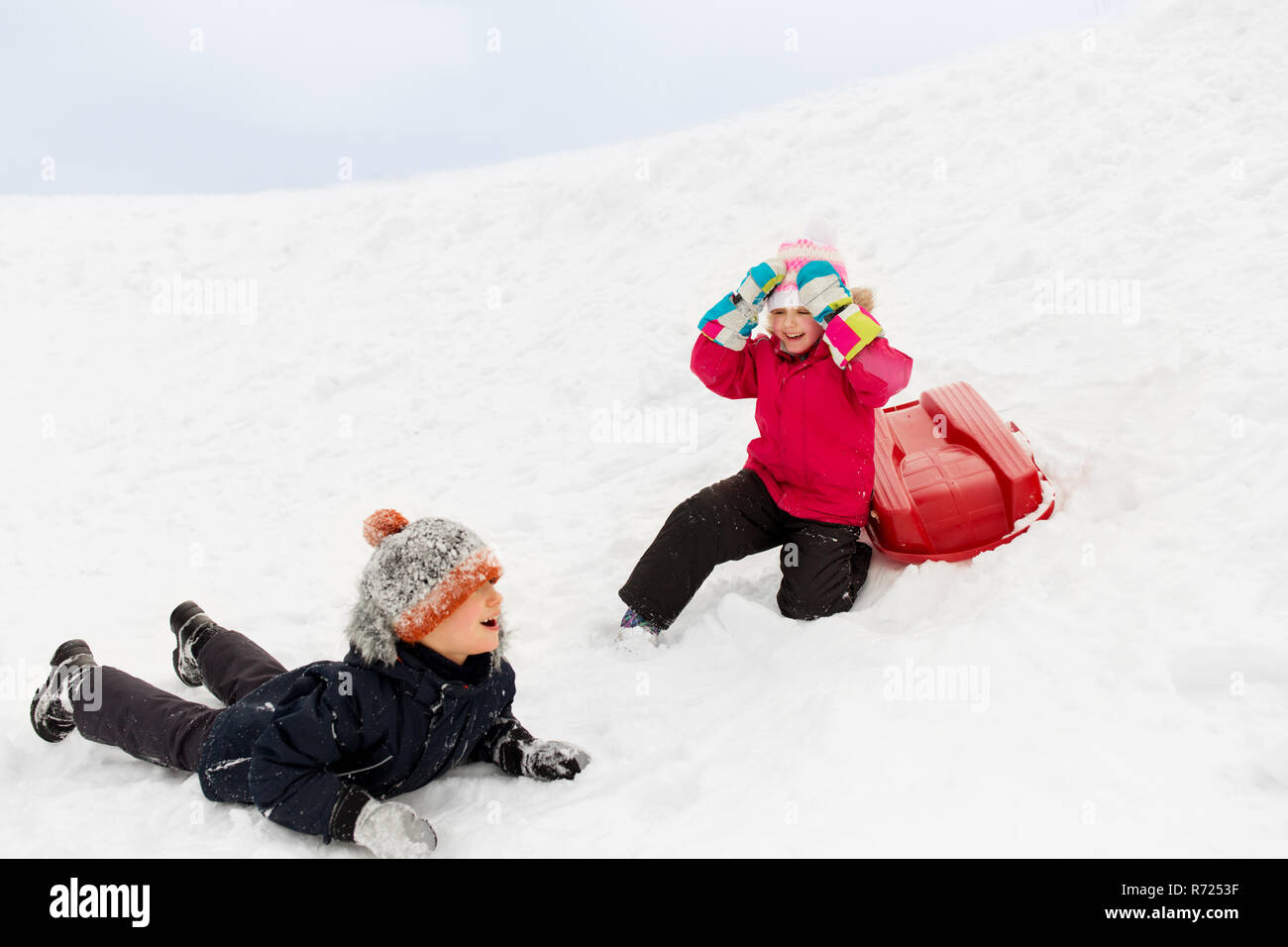 Boy lying down in snow hi-res stock photography and images - Alamy