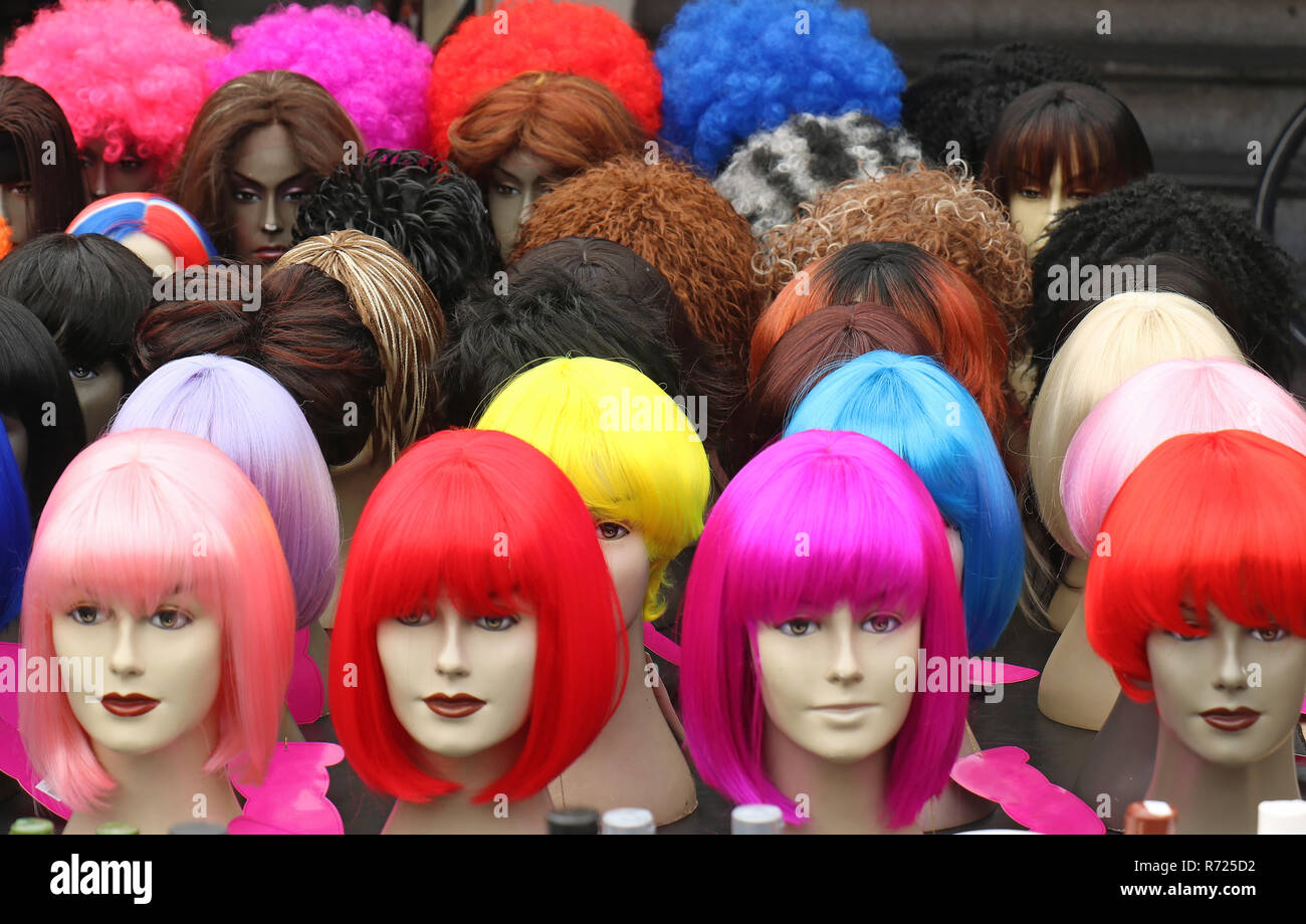 Colorful female wigs sold on market Stock Photo - Alamy