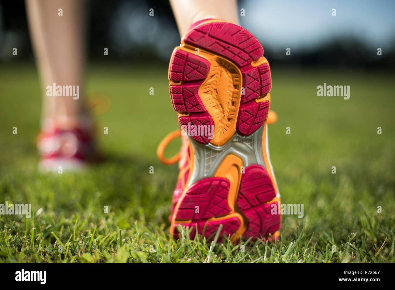 Runner feet running on road closeup on shoe Stock Photo - Alamy