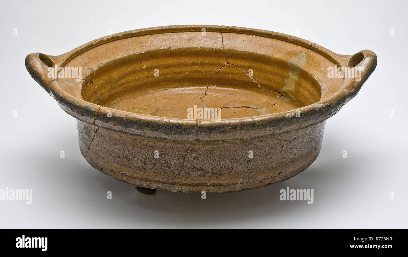 Pottery cooking pot on three legs, low and wide model with two angled ...