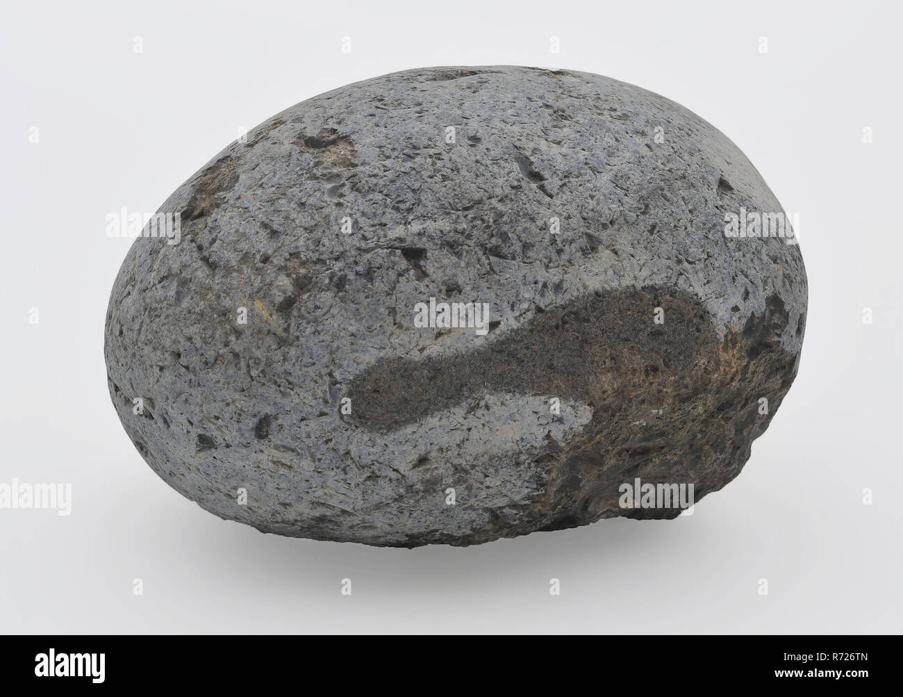 Gray smooth boulder of flint with round shape, flint lighter equipment ...