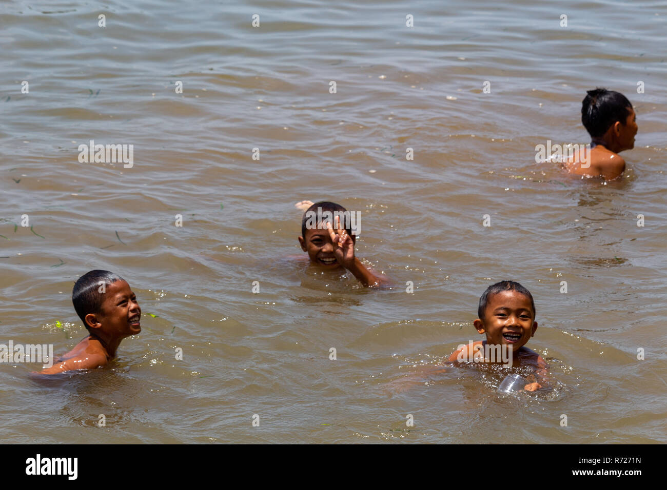 Lao children playing in river hi-res stock photography and images - Alamy