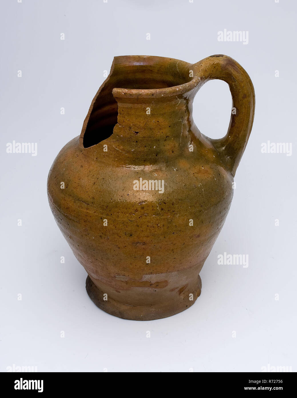 Pottery pouring jug, glazed on stand, with standing ear, water jug ...