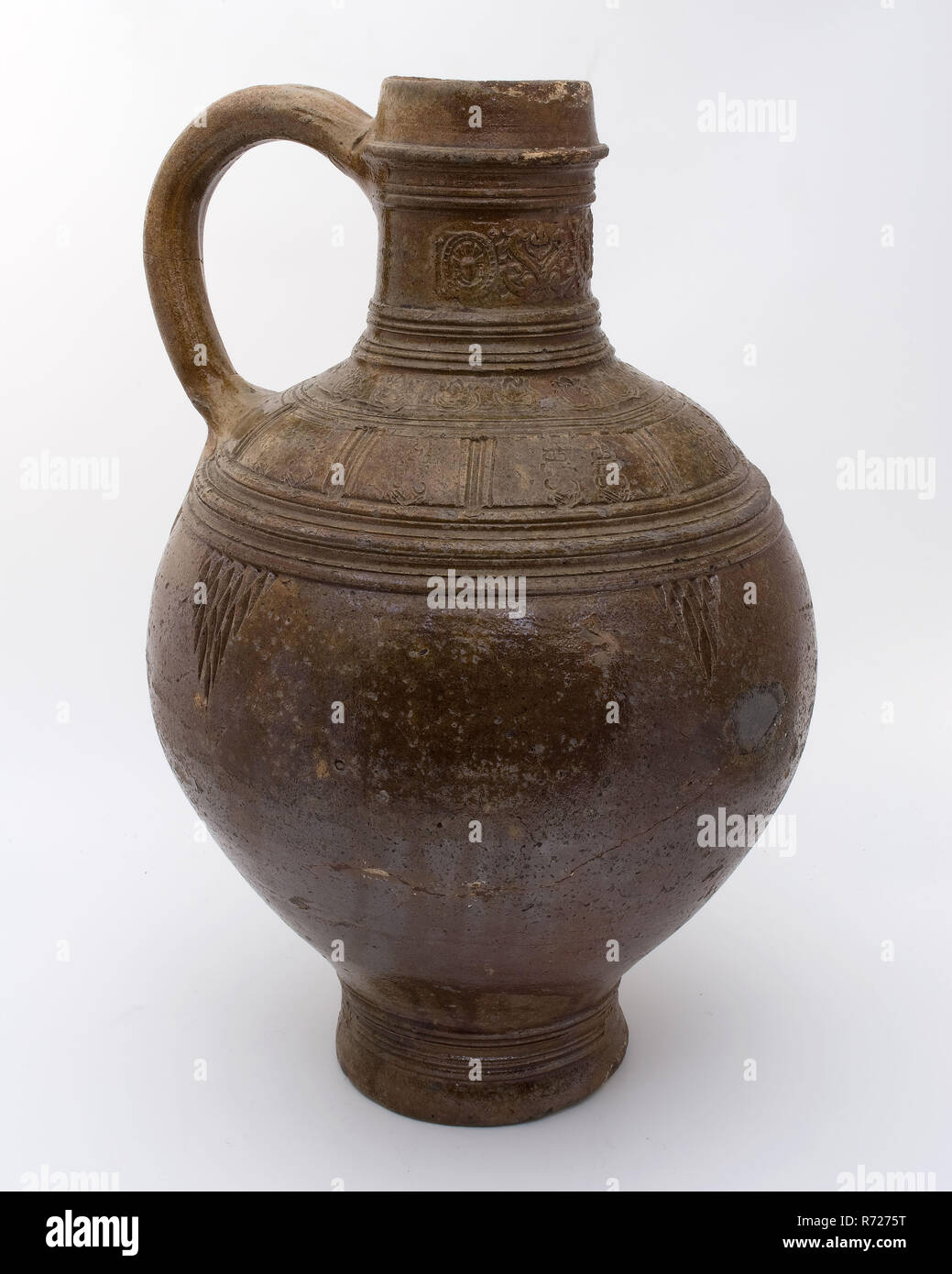 Large stoneware bullet, big ear, brown glazed, decorated with floral ...