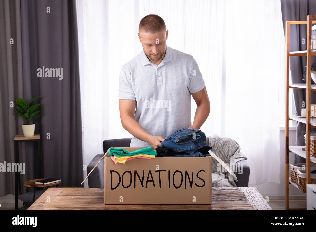 Donating clothes hi-res stock photography and images - Alamy
