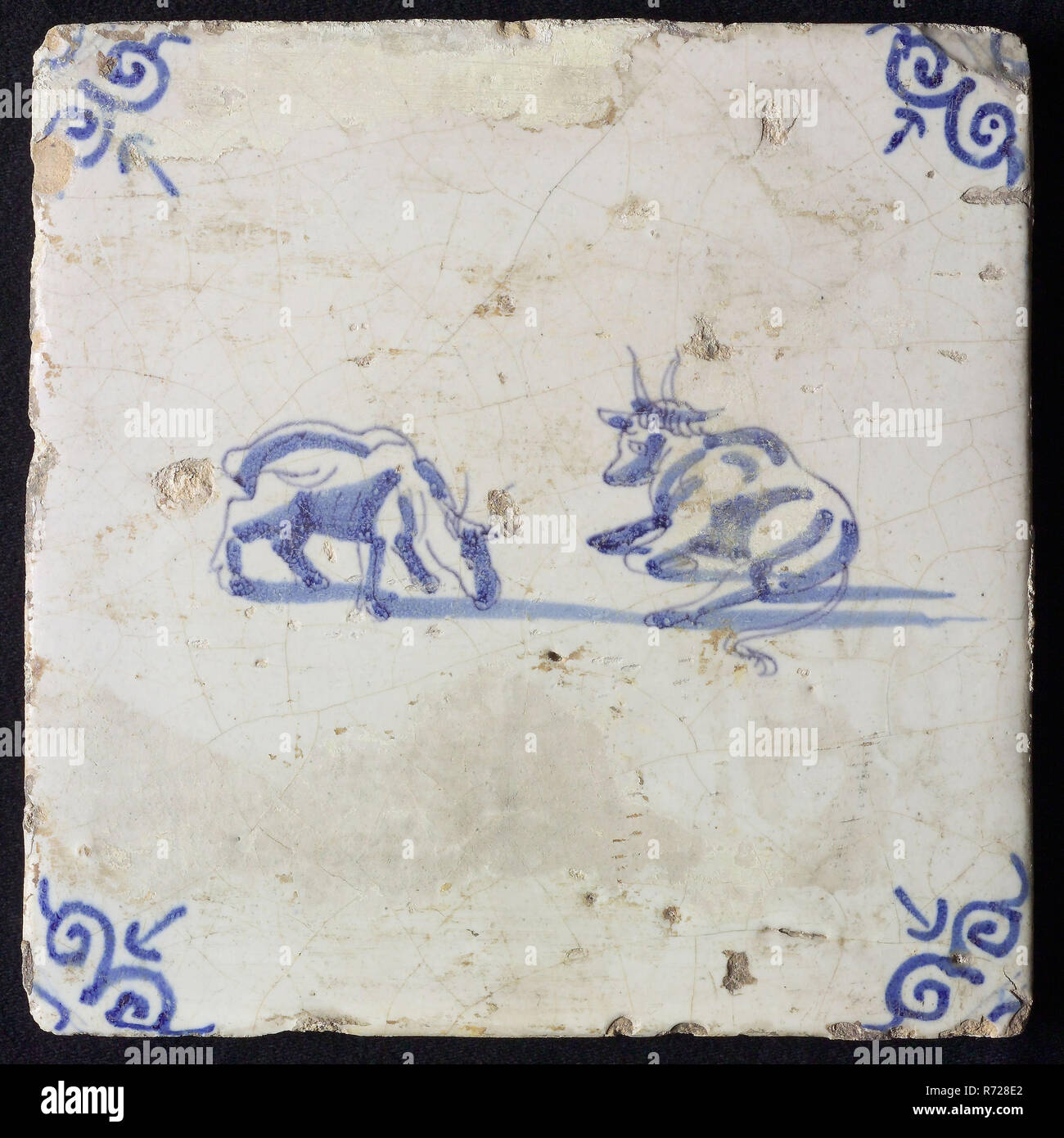Animal tile, lying and grazing ox, in blue on white, corner motif ...