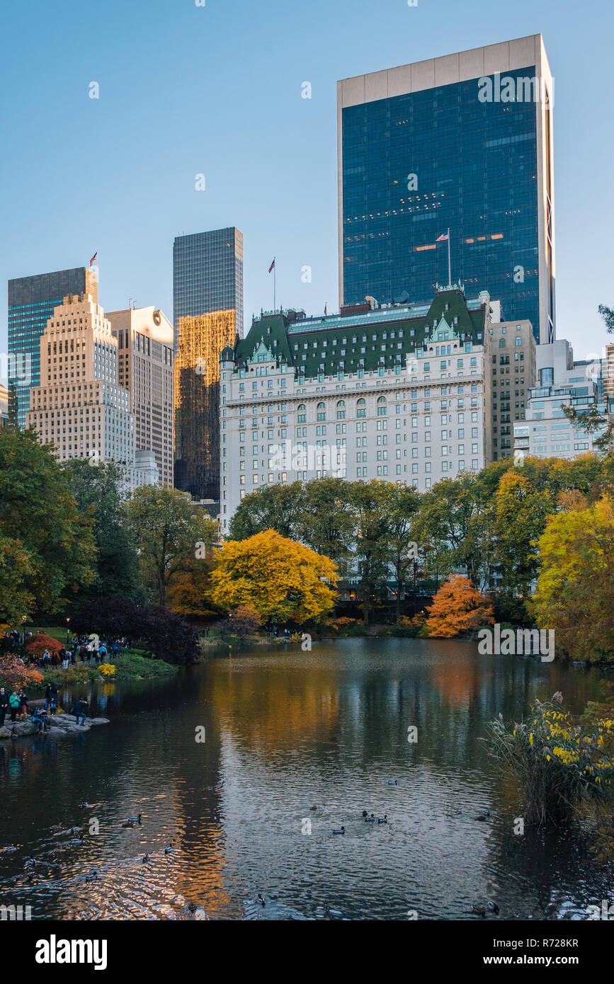 Autumn color along The Pond and buildings in Midtown Manhattan, New ...
