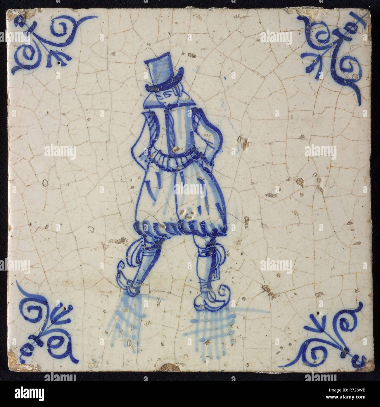 Figure tile, blue with skating man, with breeches and top hat, corner ...